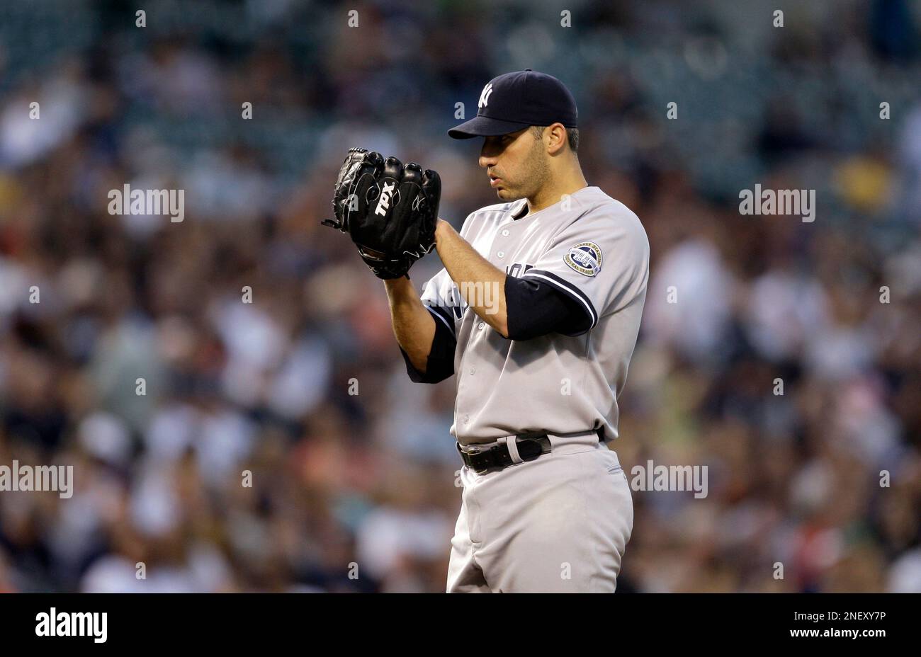 New York Yankees starting pitcher Andy Pettitte prepares to throw to a ...