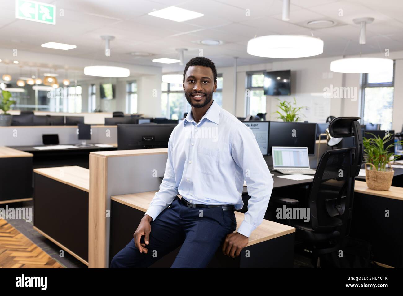 Happy african office worker hi-res stock photography and images - Alamy