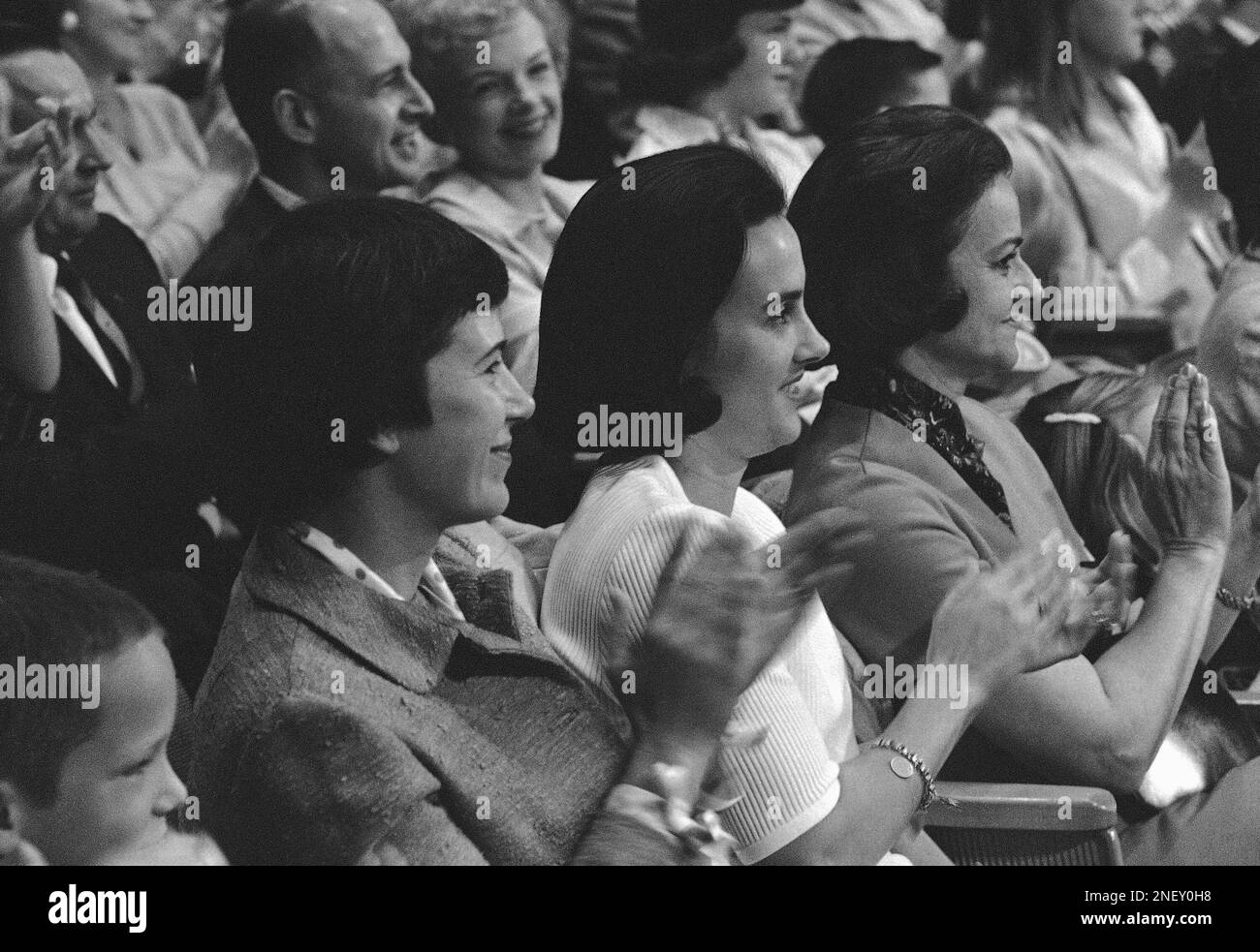 Mrs. Neil A. Armstrong, left, and Mrs. David R. Scott, center, applaud ...