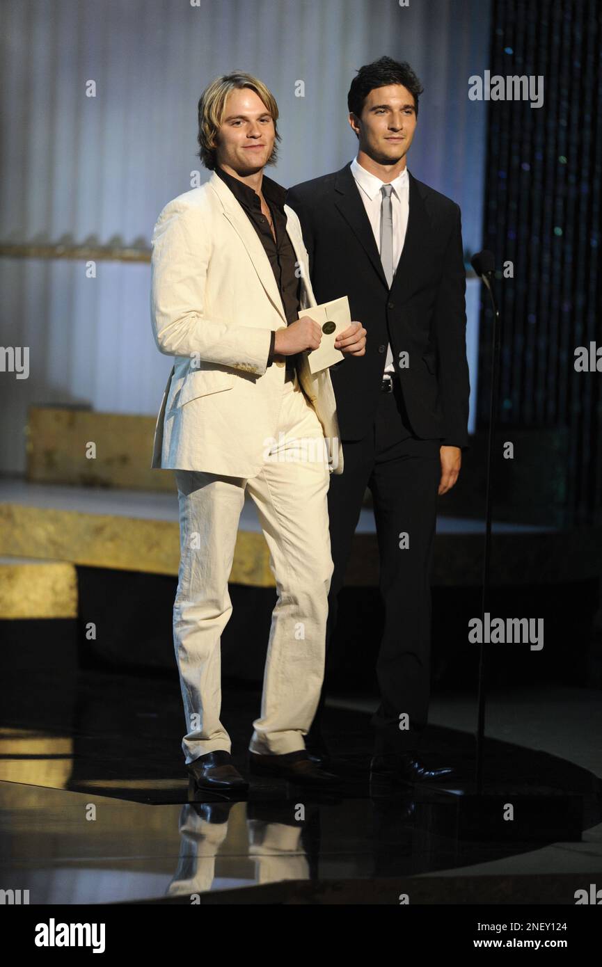 Van Hansis, left, and Jake Silbermann present the award for outstanding ...
