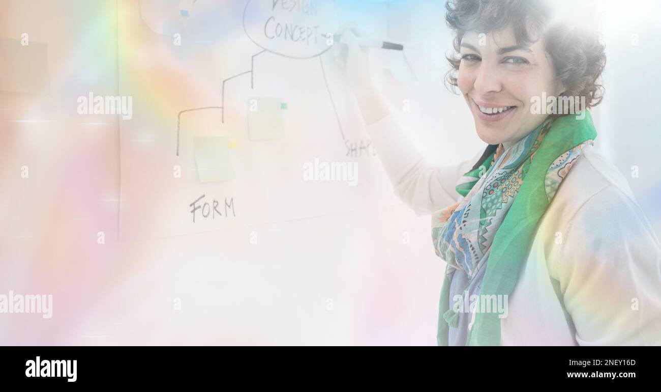 Composition of smiling businesswoman writing on whiteboard in office ...