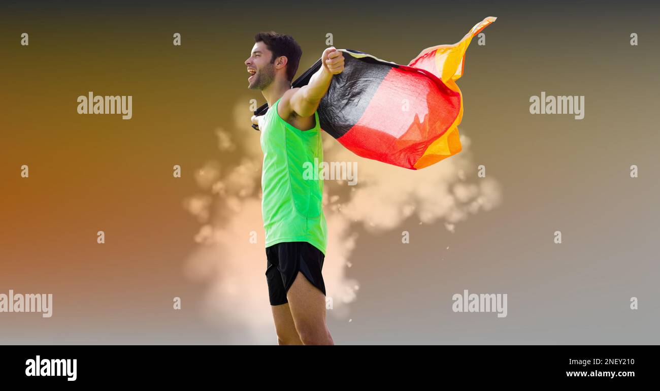 Composition of strong smiling caucasian male athlete holding german ...
