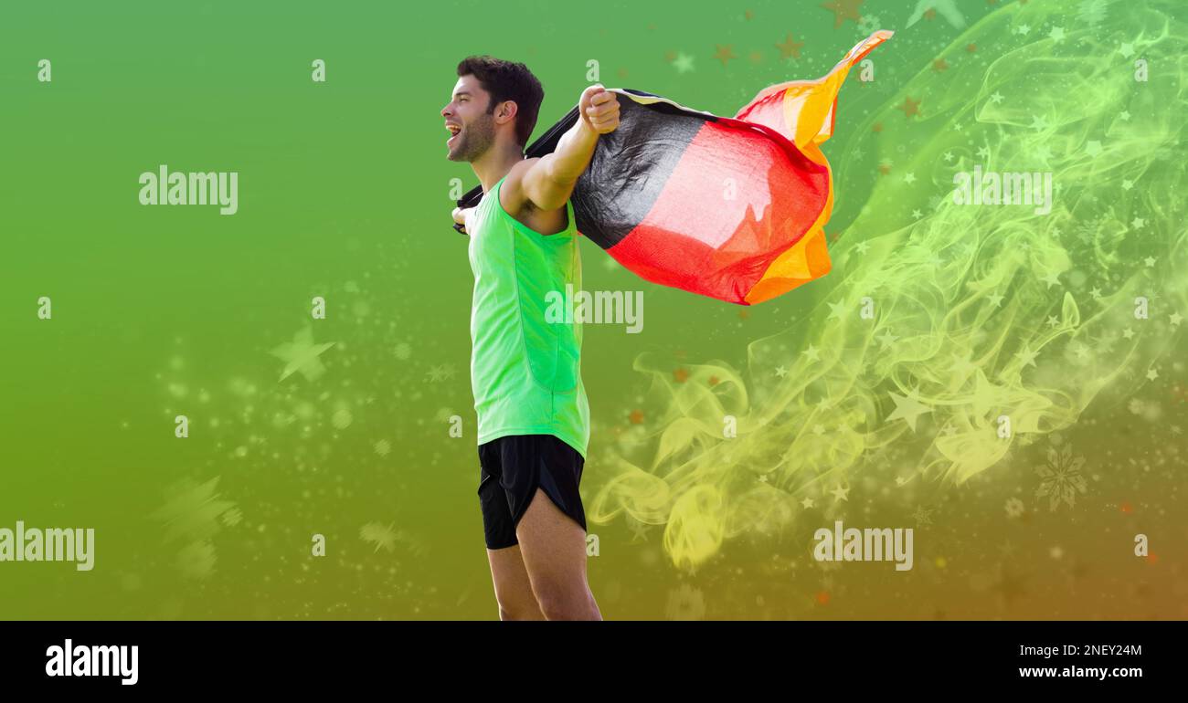 Composition of strong smiling caucasian male athlete holding german ...