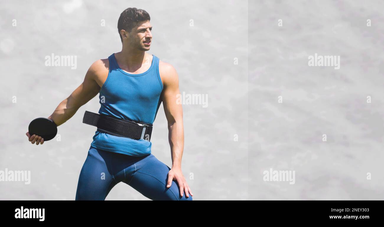 Composition of male discus thrower with copy space on grey background ...