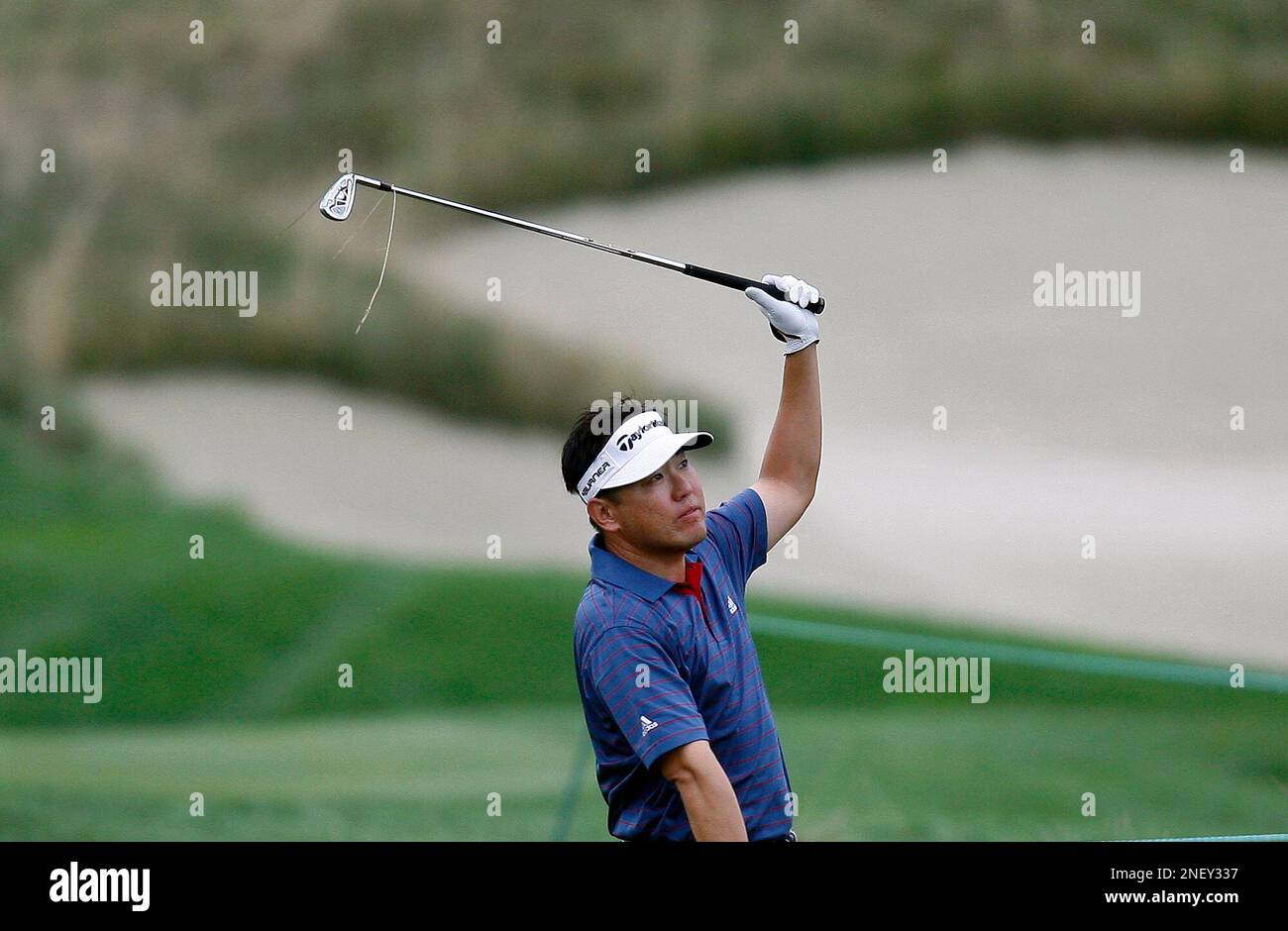 Charlie Wi hits from the rough off course on the third hole during the ...