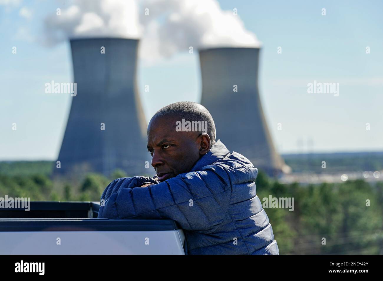 Georgia Power Co. CEO Chris Womack rests on a company truck as he talks ...
