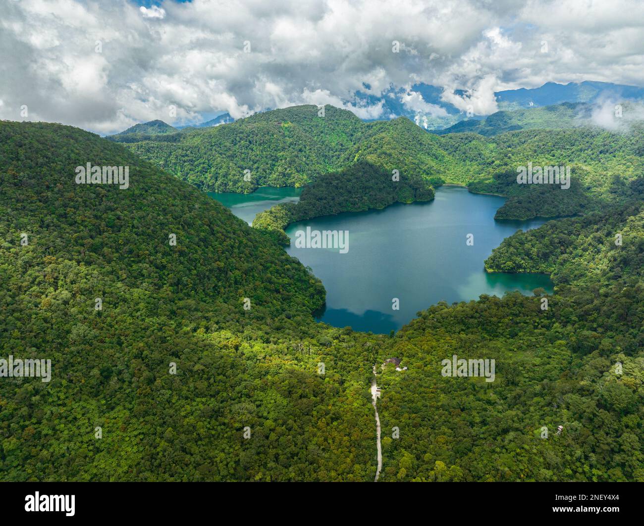Lake in the mountains among the rainforest and jungle. Balinsasayao ...
