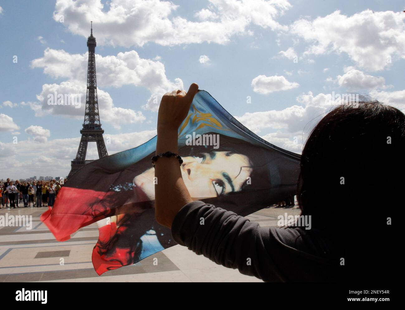 A Michael Jackson fan holds a flag of the late King of Pop during the ...