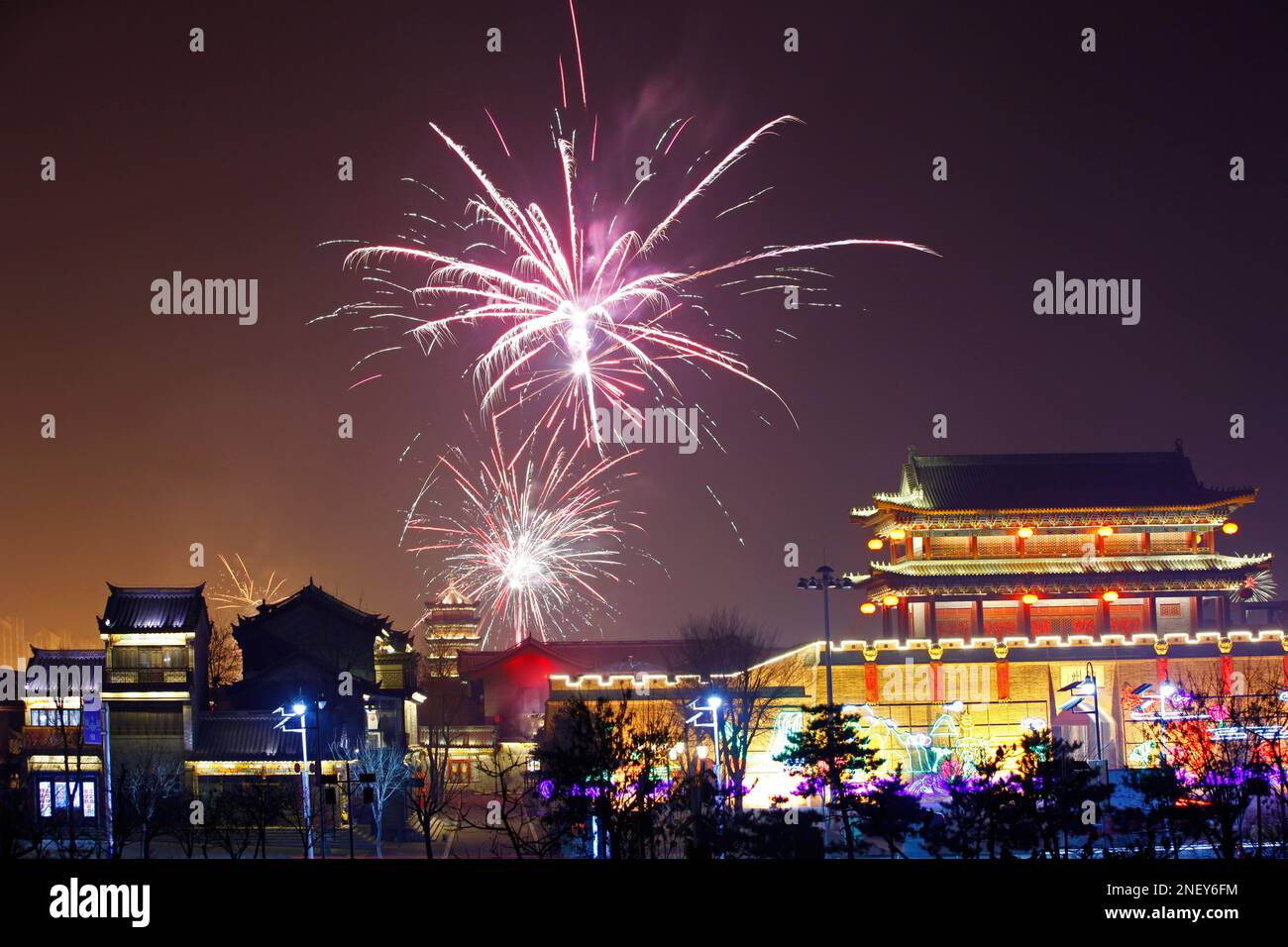 Fireworks up ancient buildings at night, in China Stock Photo - Alamy