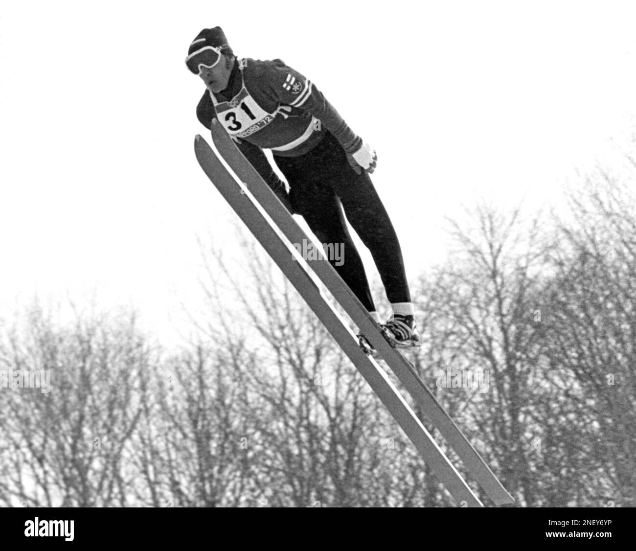 Rauno Miettinen of Finland flies high over the trees as he leaps into ...