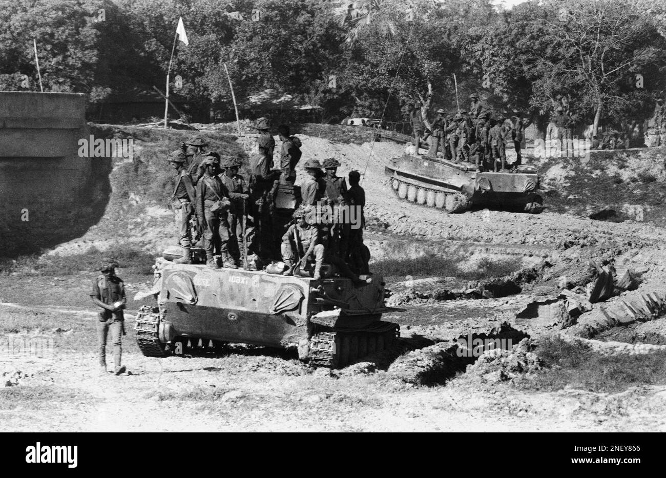 Indian armored columns of tanks advance through the plains of ...