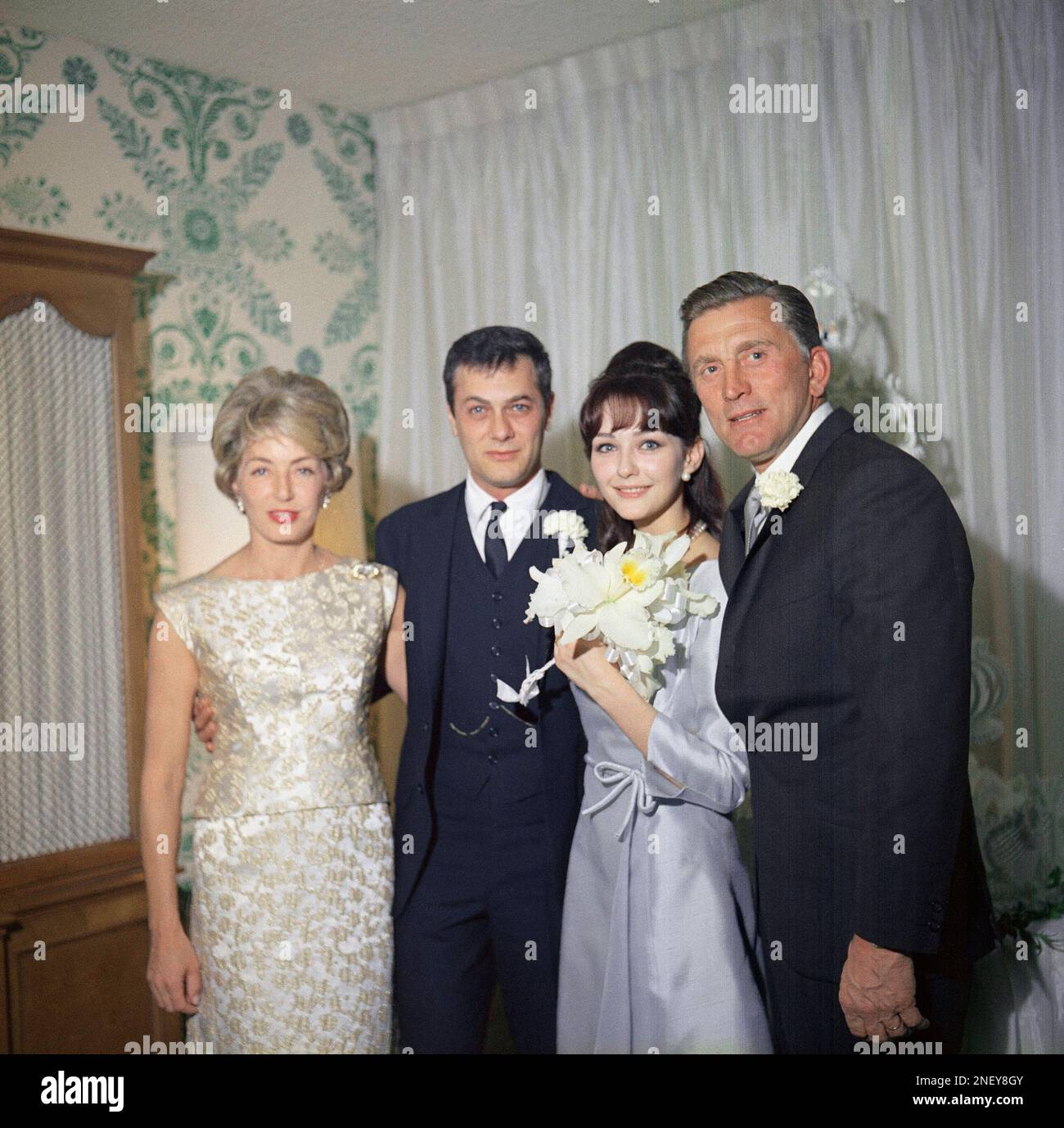Actor Tony Curtis, second from left, and his new wife Christine ...