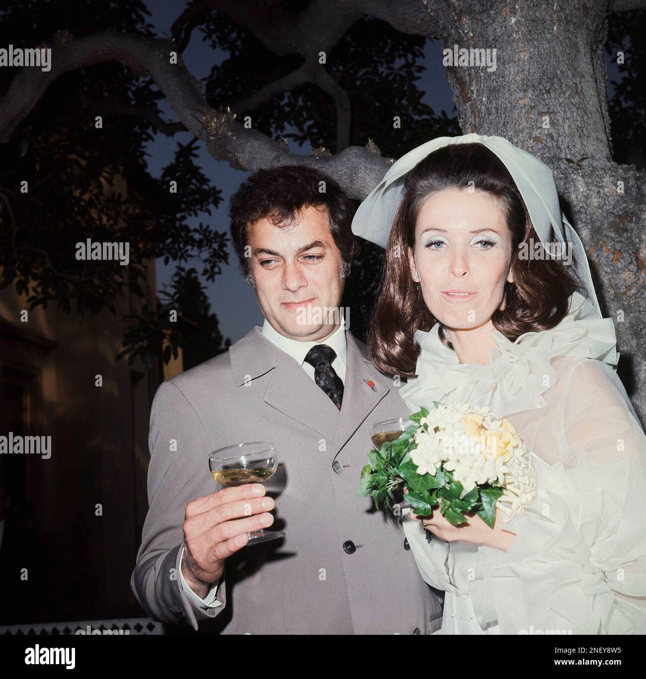 Tony Curtis and his bride, model Leslie Allen, pose at the Curtis home ...