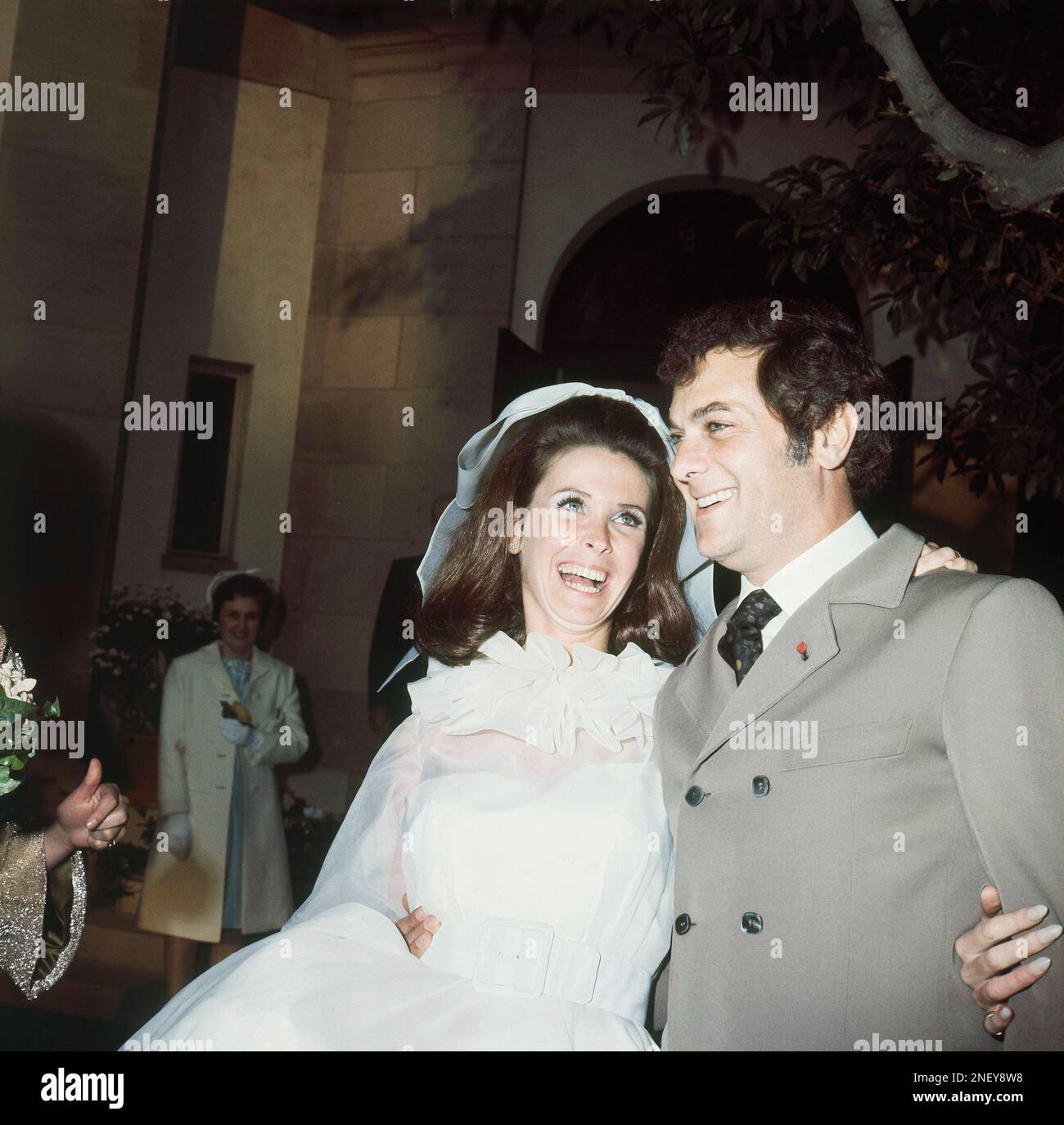 Tony Curtis and his bride, model Leslie Allen, pose at the Curtis home ...