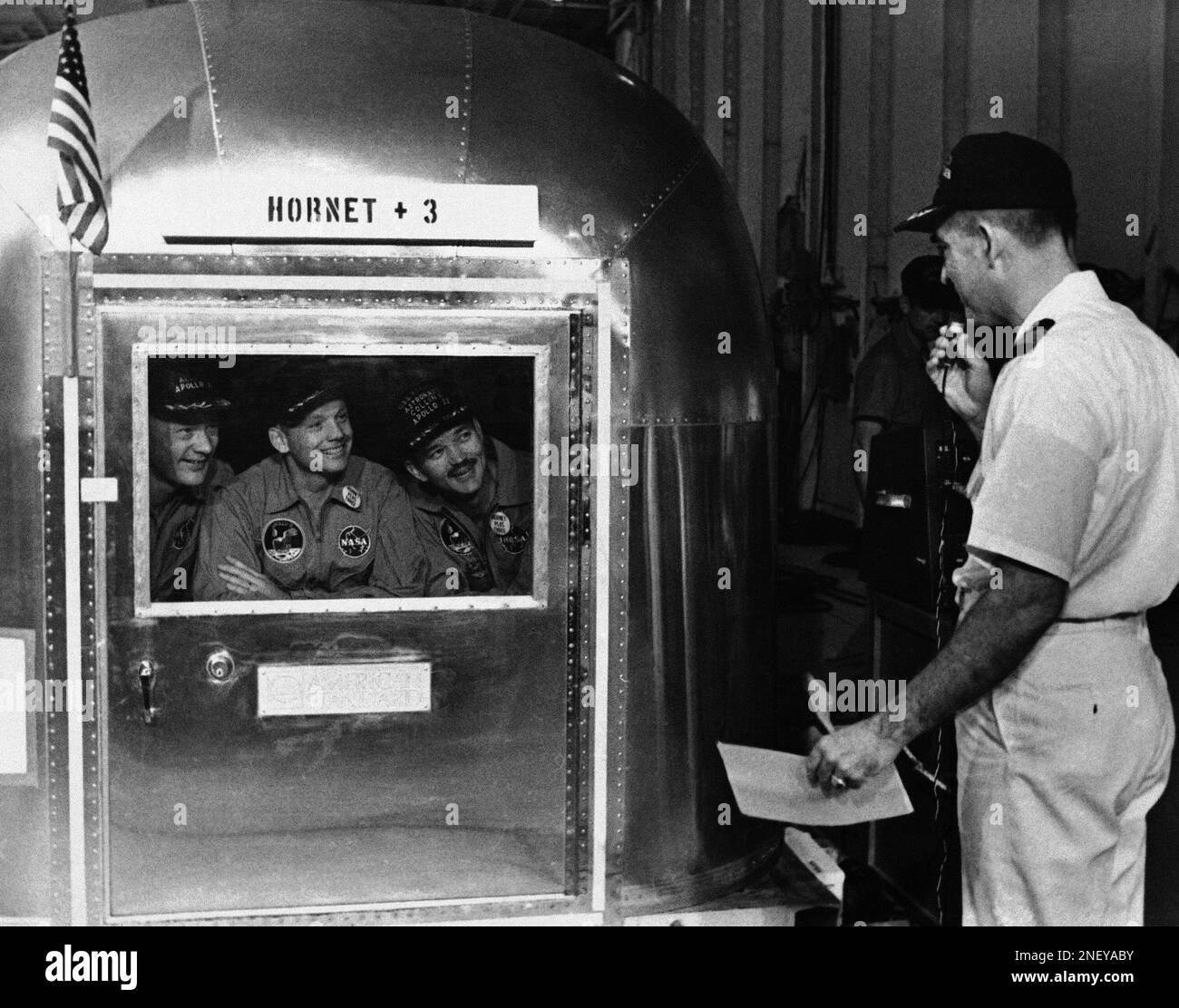 Capt. Carl Seiberlich, commander of the carrier Hornet, right, says ...