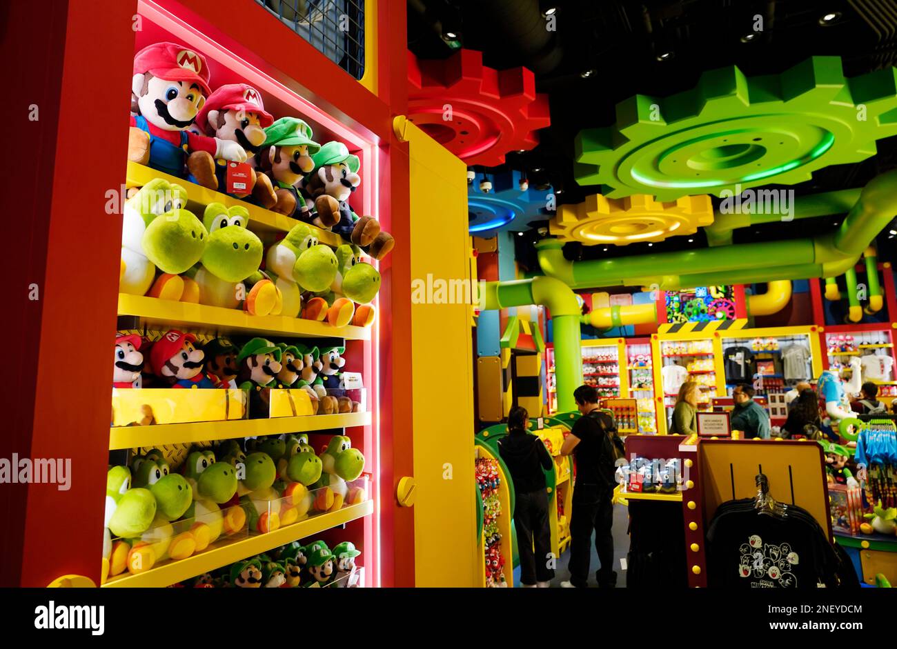 Shoppers browse through Nintendo-themed merchandise in the 1-UP Factory ...