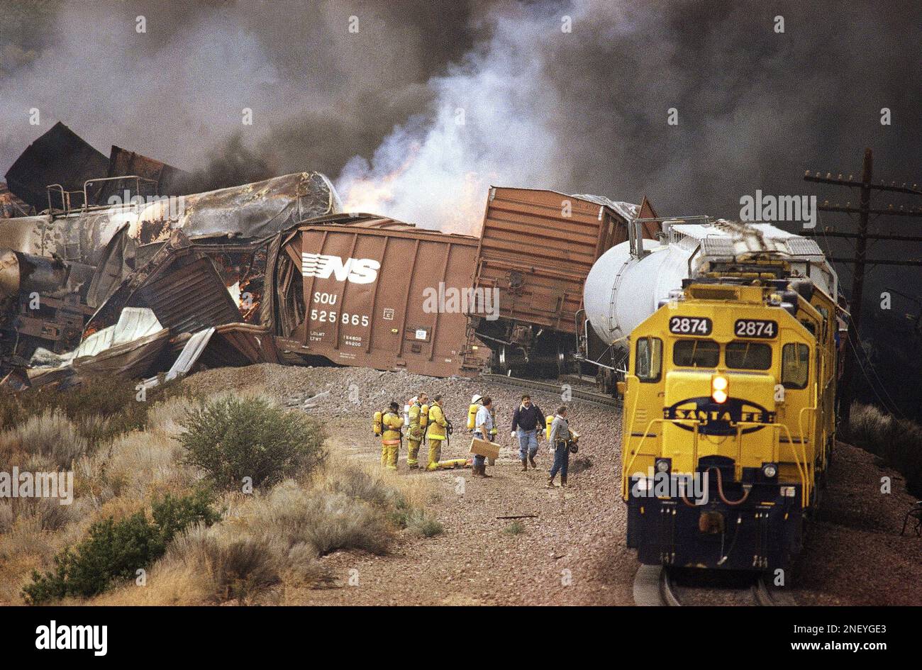 Firefighters view the scene of a train derailment in the Cajon Pass, about 10 miles north of San ...