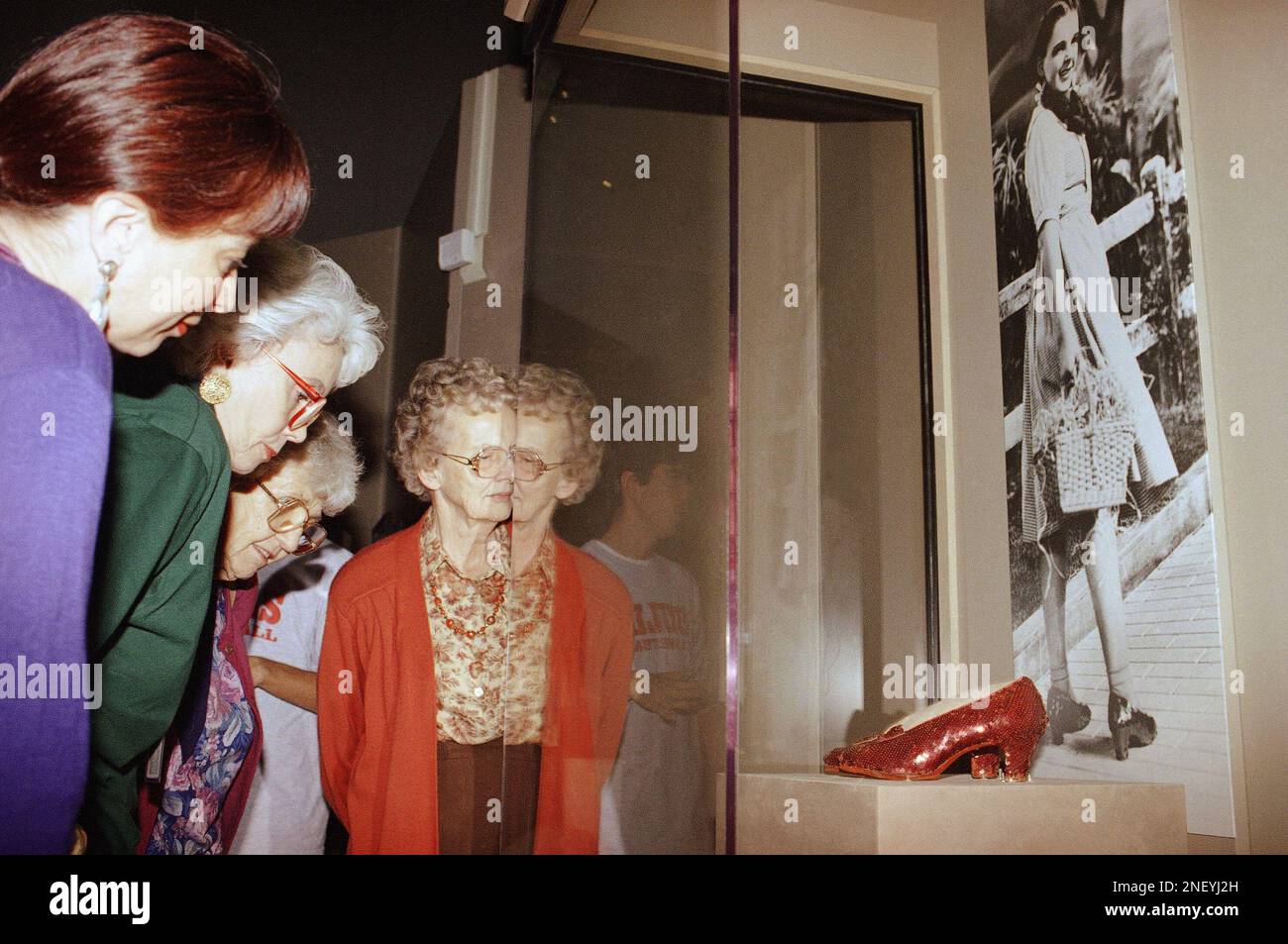 Spectators view a pair of “Ruby Slippers”, worn by Judy Garland in “The ...