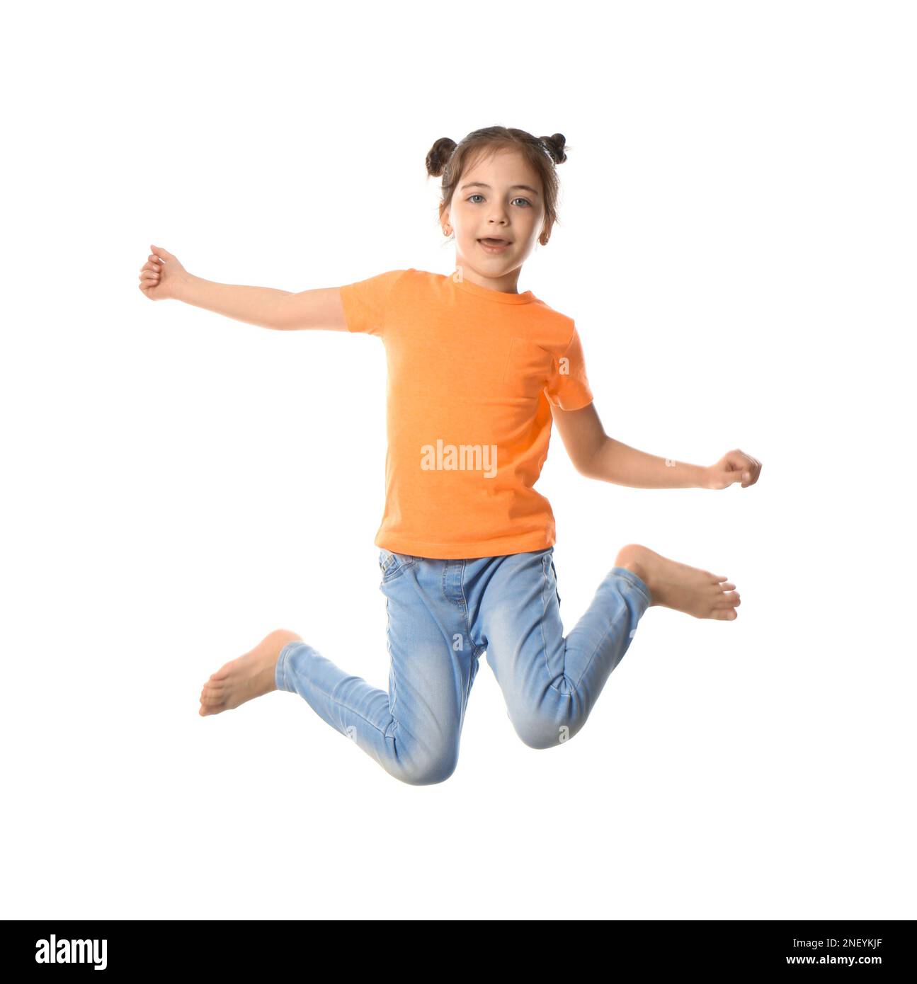 Cute little girl jumping on white background Stock Photo - Alamy