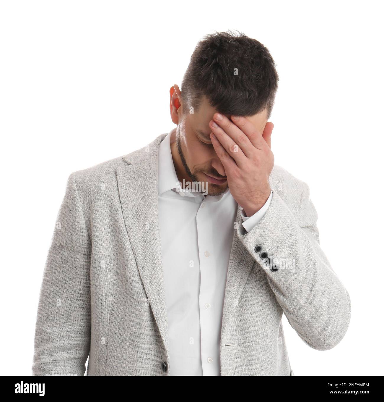 Upset man covering face with hand on white background Stock Photo - Alamy