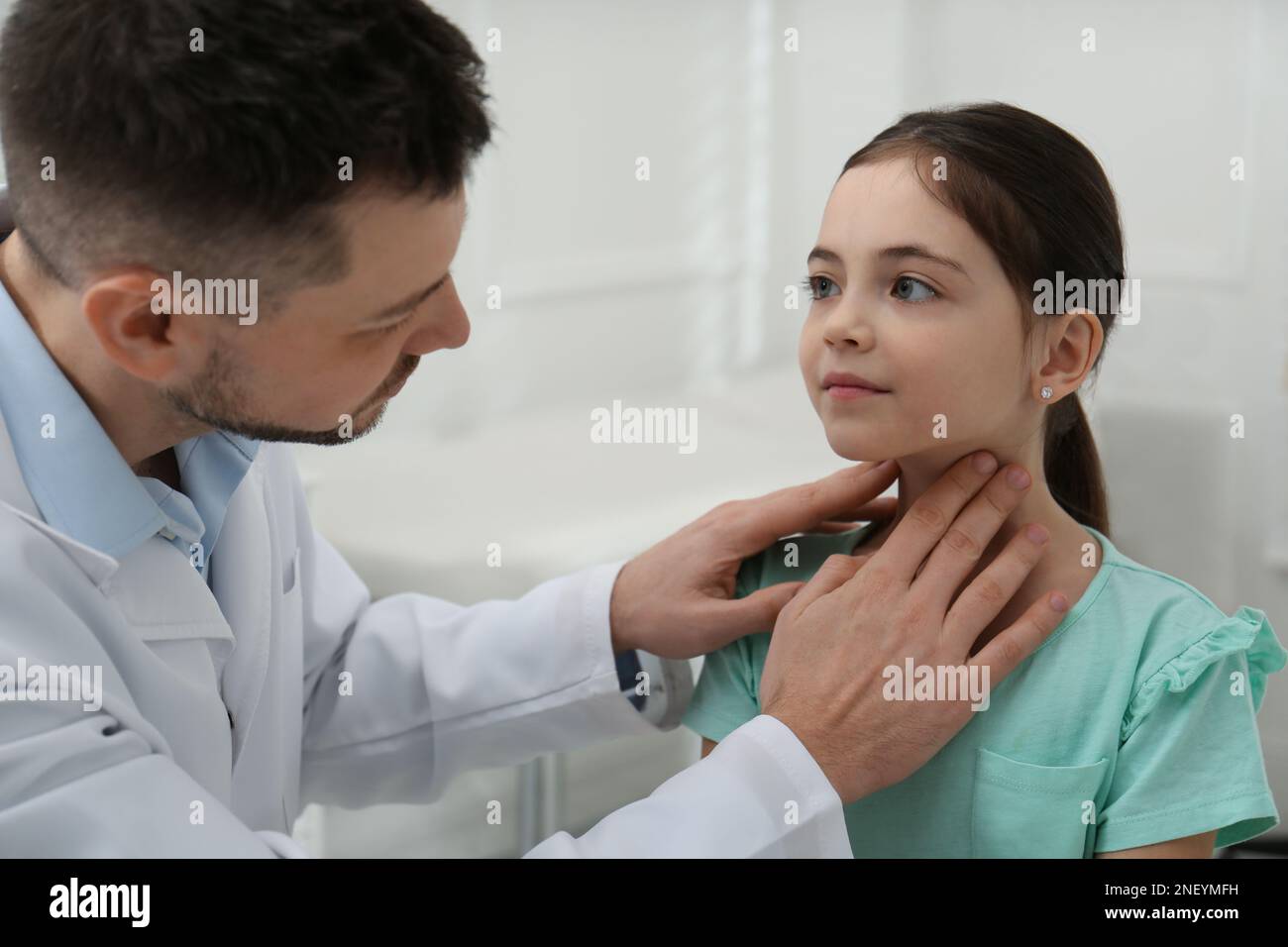 Pediatrician examining little girl in office at hospital Stock Photo ...