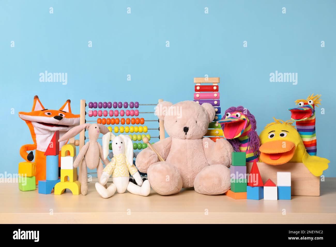 Collection of different toys on wooden table Stock Photo - Alamy