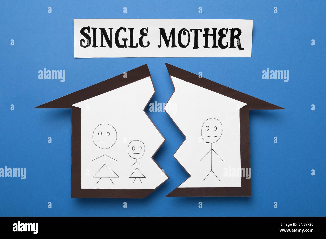 Being single mother after divorce concept. Paper cutouts demonstrating ...