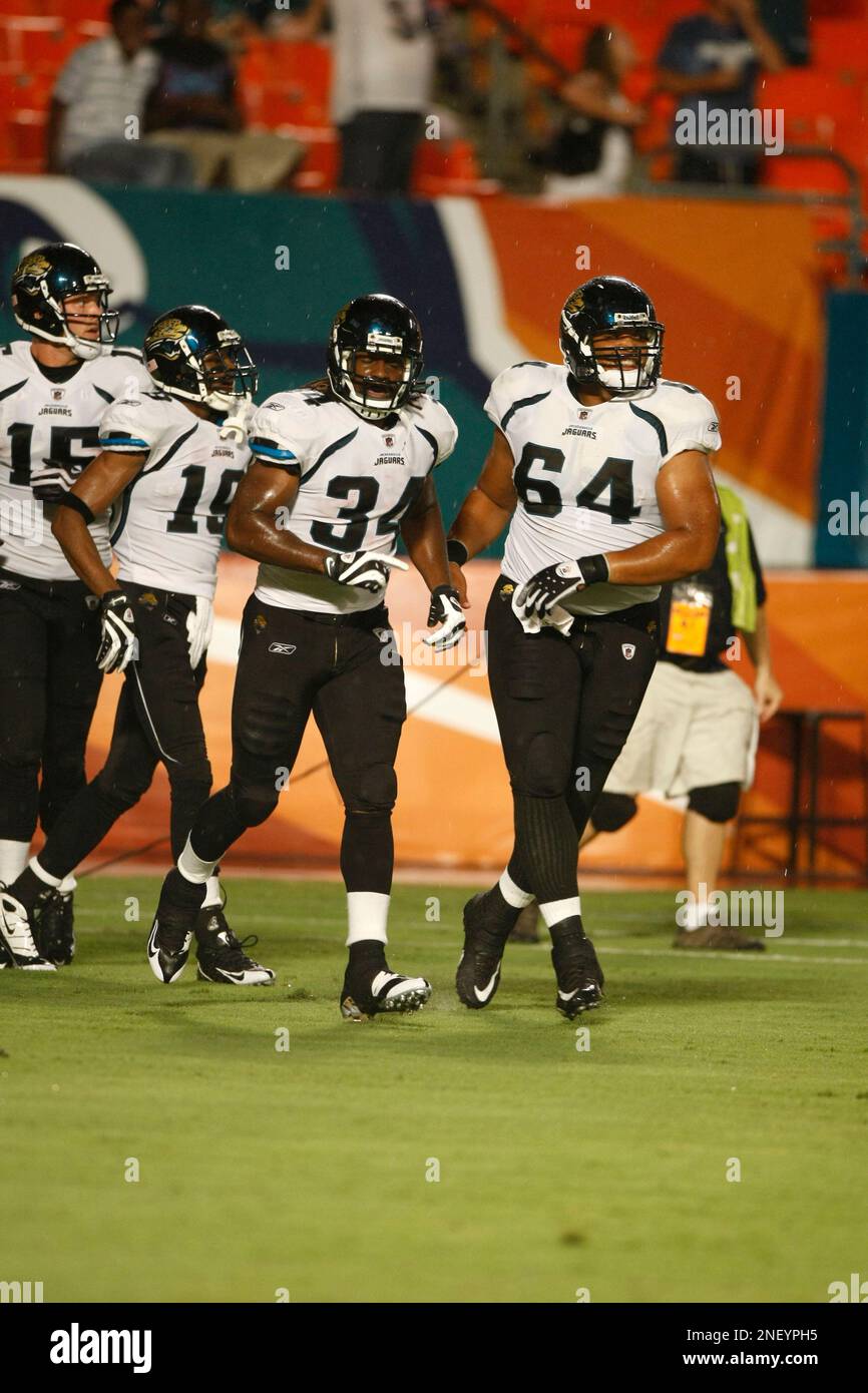 Jacksonville Jaguars center Cecil Newton (64), Chauncy Washington (34 ...