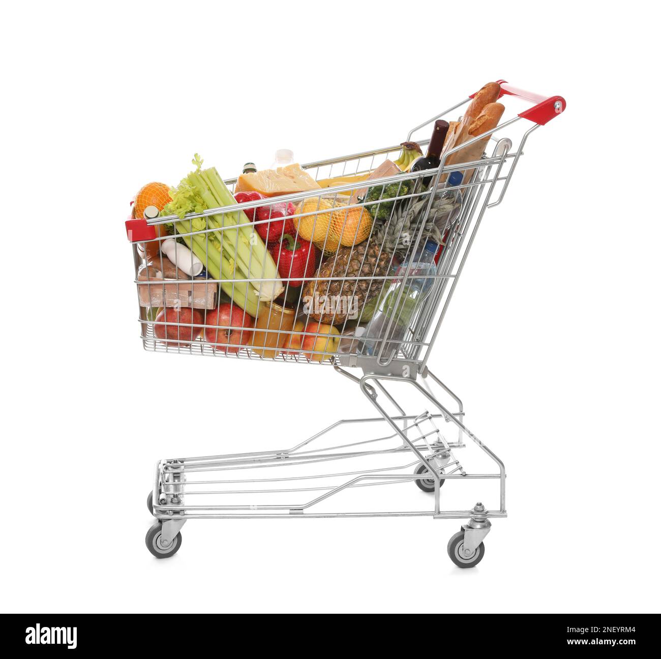 Shopping cart full of groceries on white background Stock Photo - Alamy
