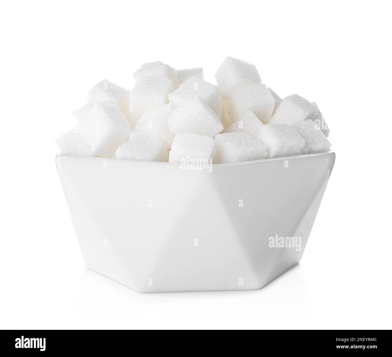 Sugar cubes in bowl on white background Stock Photo - Alamy
