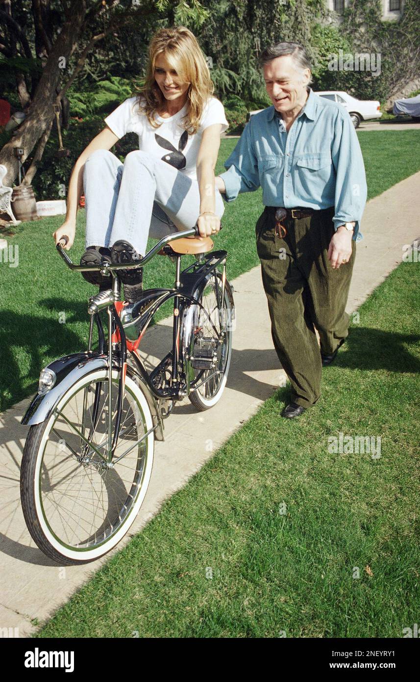 Playboy founder Hugh Hefner pushes his wife Kimberly on Schwinn's ...