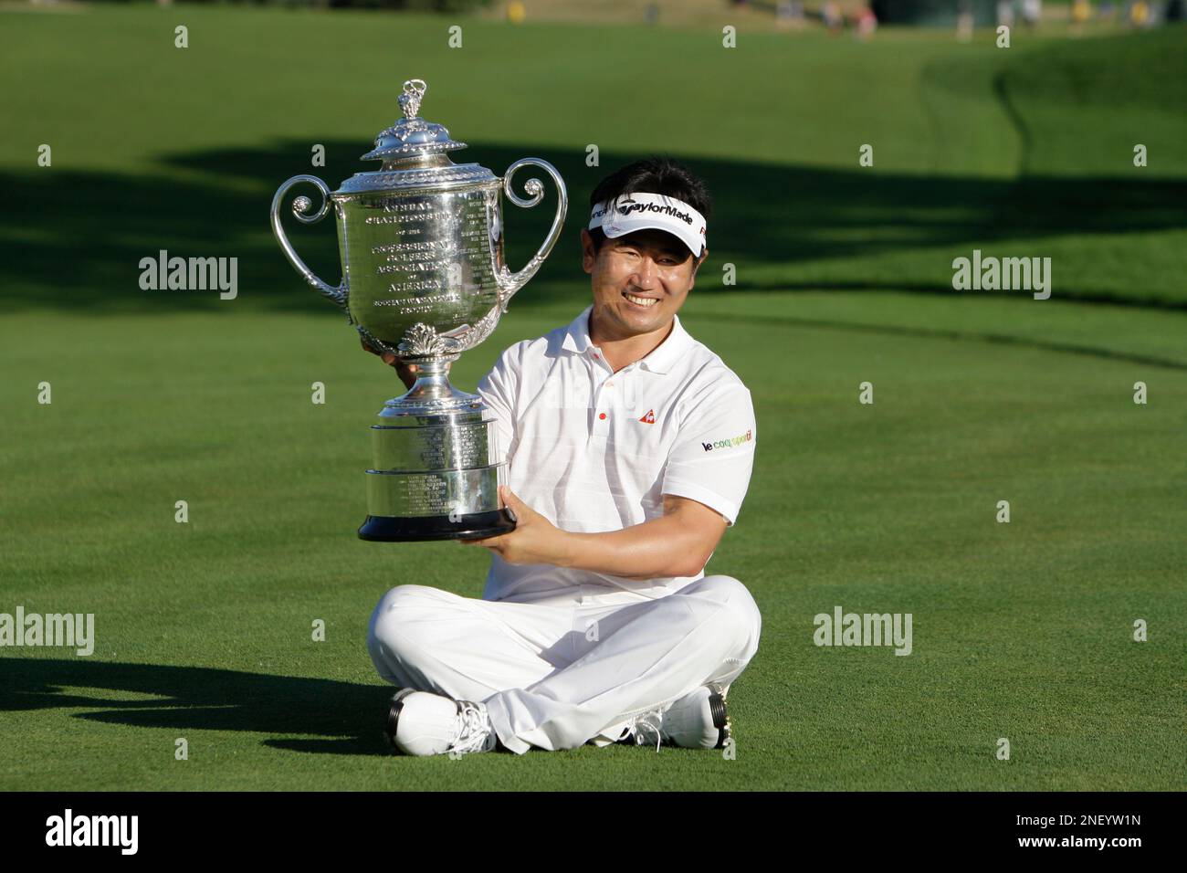 Y.E. Yang, of South Korea, poses with the Wanamaker Trophy after ...