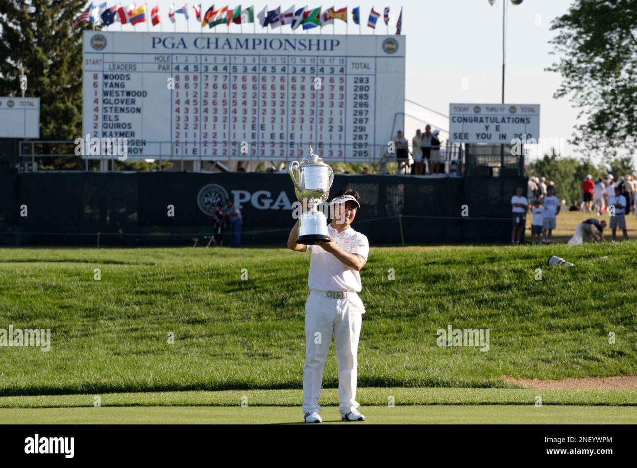 Y.E. Yang, of South Korea, holds up the Wanamaker Trophy after winning ...