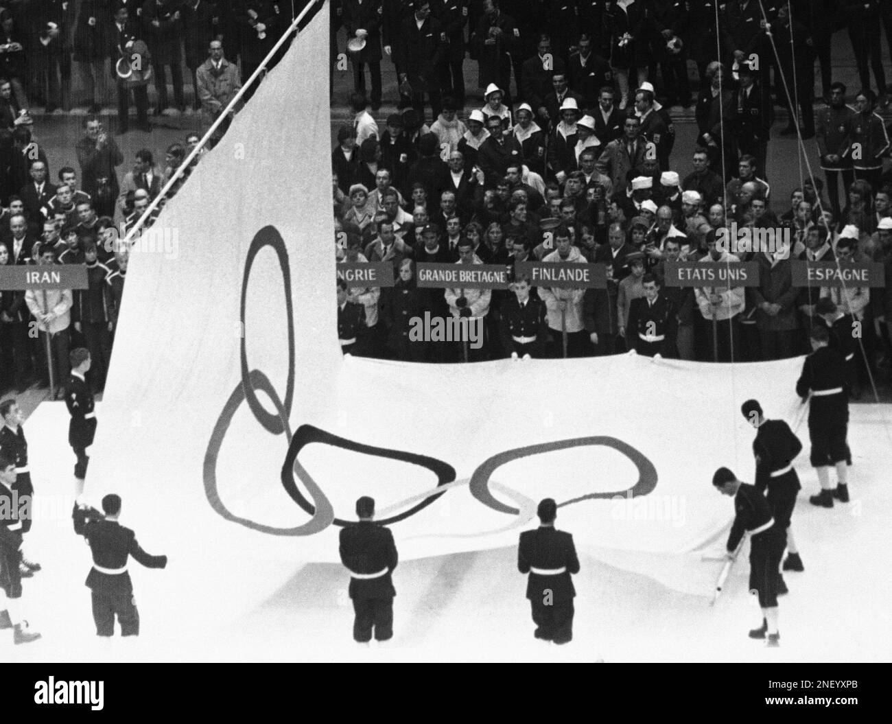 The white five-ringed Olympic flag is lowered during impressive closing ...