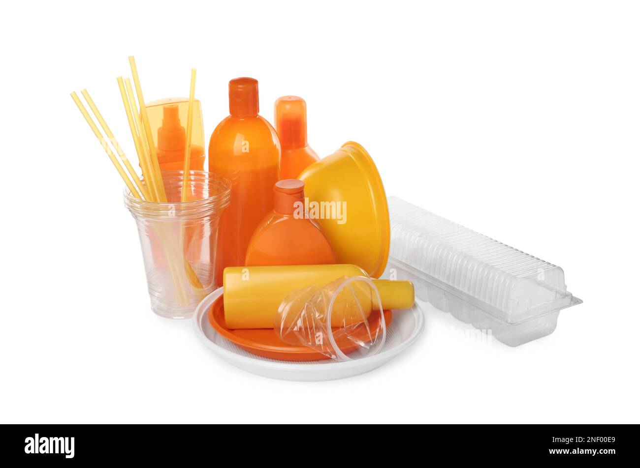 Pile of different plastic items on white background Stock Photo - Alamy