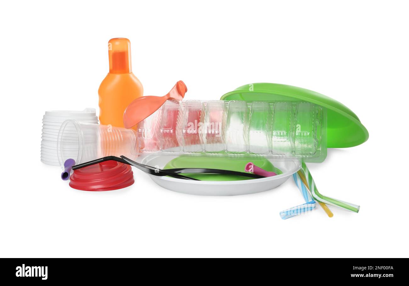 Pile of different plastic items on white background Stock Photo - Alamy