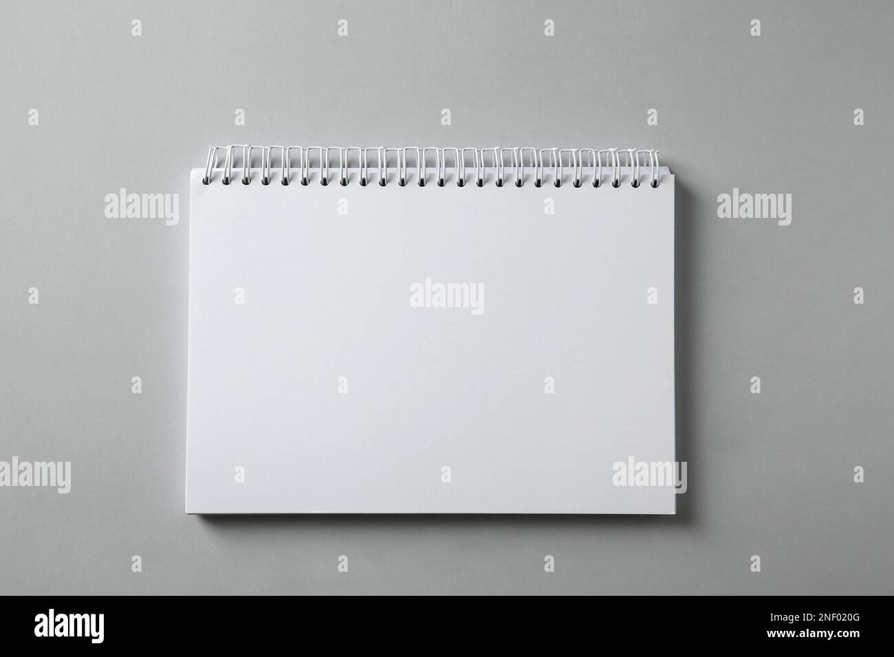 Blank notebook on grey background, top view. Mockup for design Stock ...