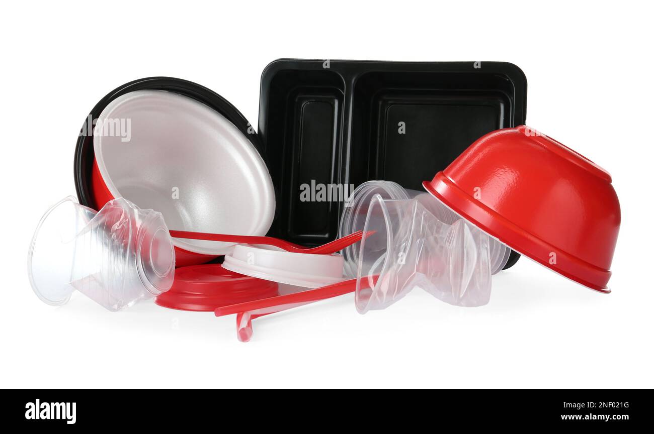 Pile of different plastic items on white background Stock Photo - Alamy