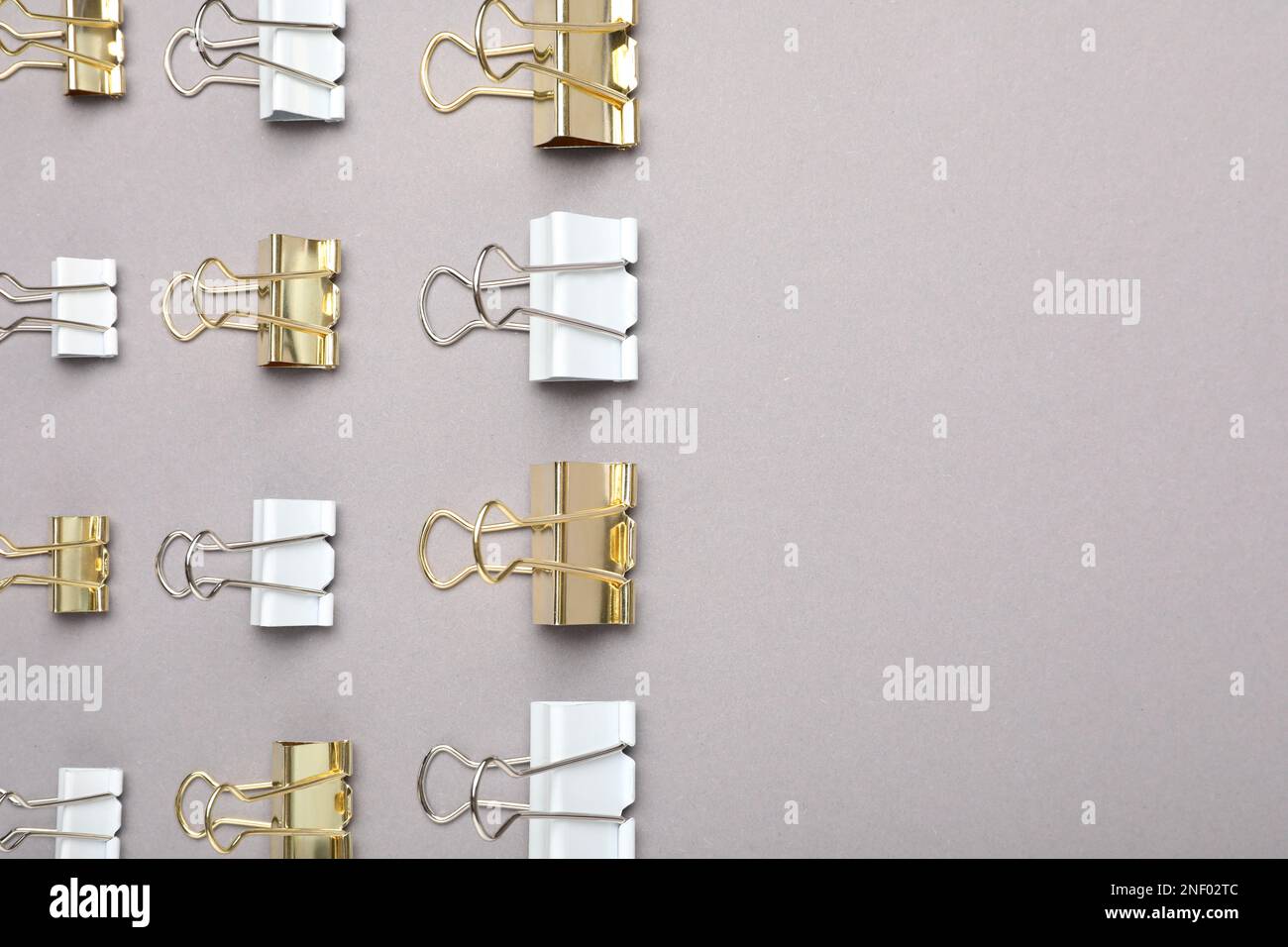 Binder clips on grey background, flat lay. Space for text Stock Photo ...