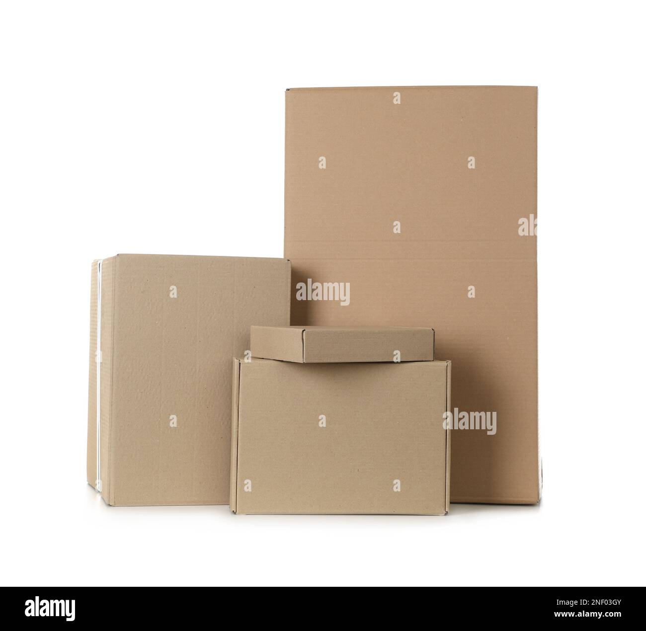 Pile of cardboard boxes on white background Stock Photo - Alamy