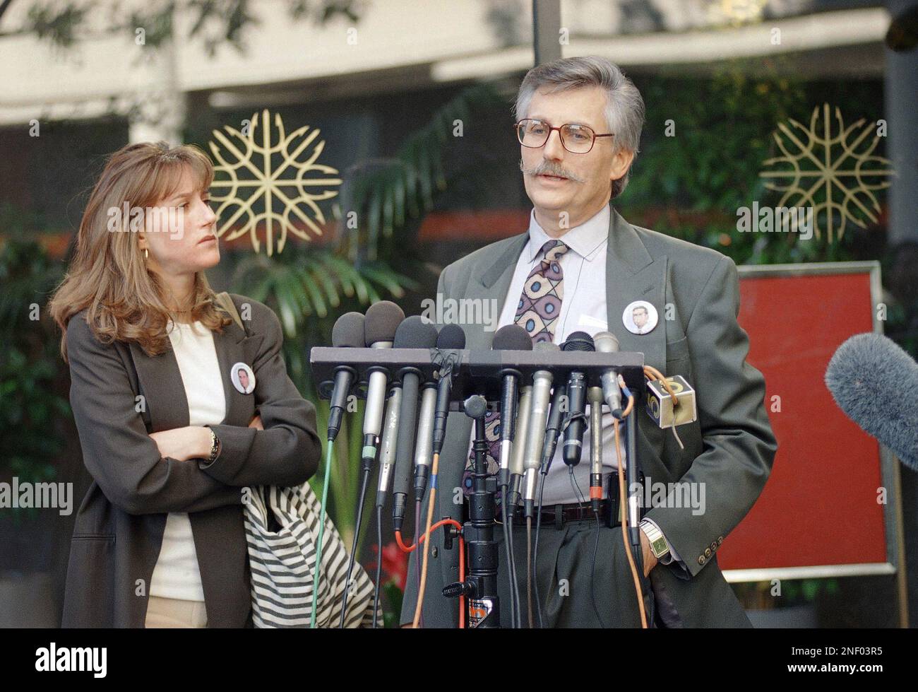 Kim Goldman watches her father, Fred Goldman, during a news conference ...