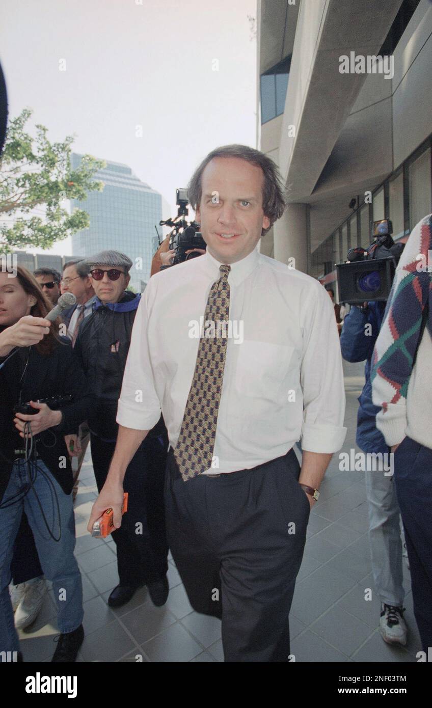 Brown family attorney, John Quinlan Kelly walks past members of the ...