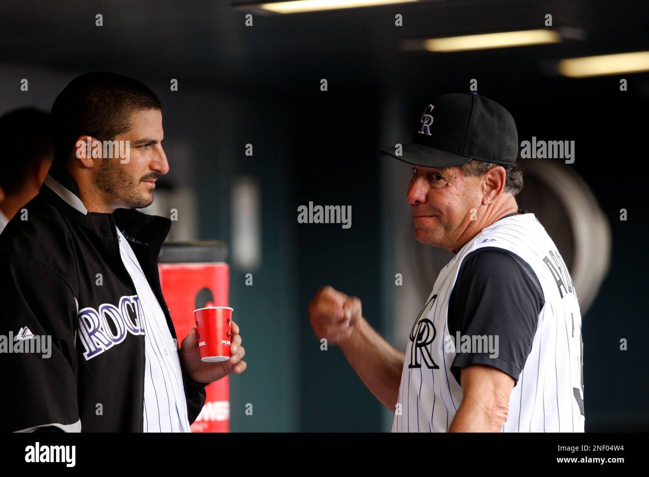Colorado Rockies pitching coach Bob Apodaca, right, confers with ...