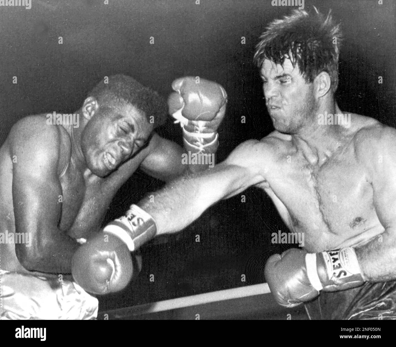 American boxer Jerry Quarry, right, lands a right hook to the head of ...