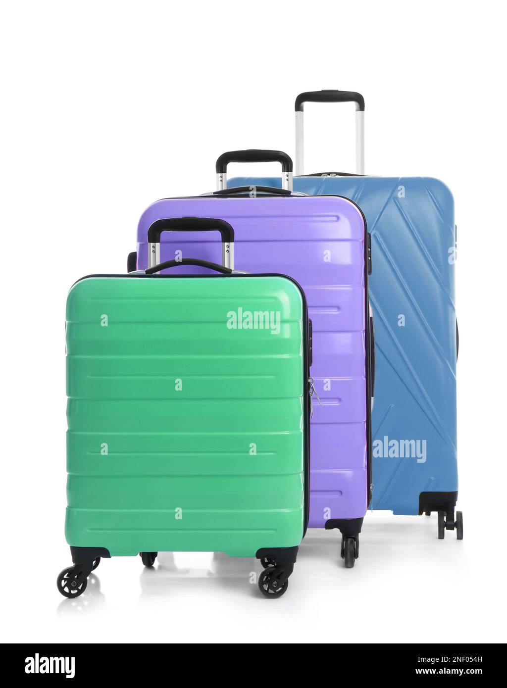 Modern suitcases for travelling on white background Stock Photo - Alamy