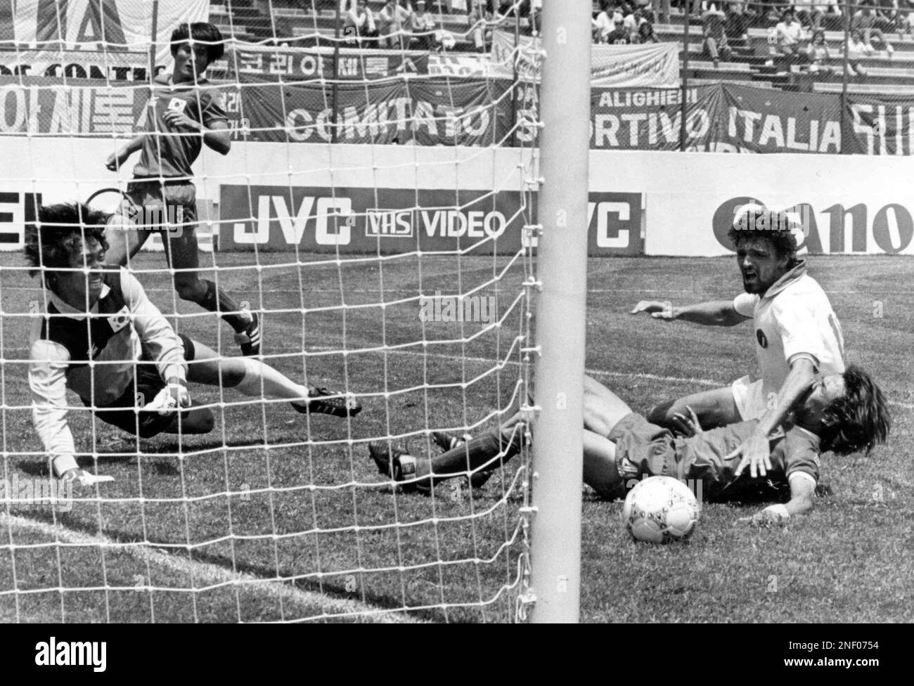 South Korean player Kwang-Rae Cho, on the ground right, with Italy's ...