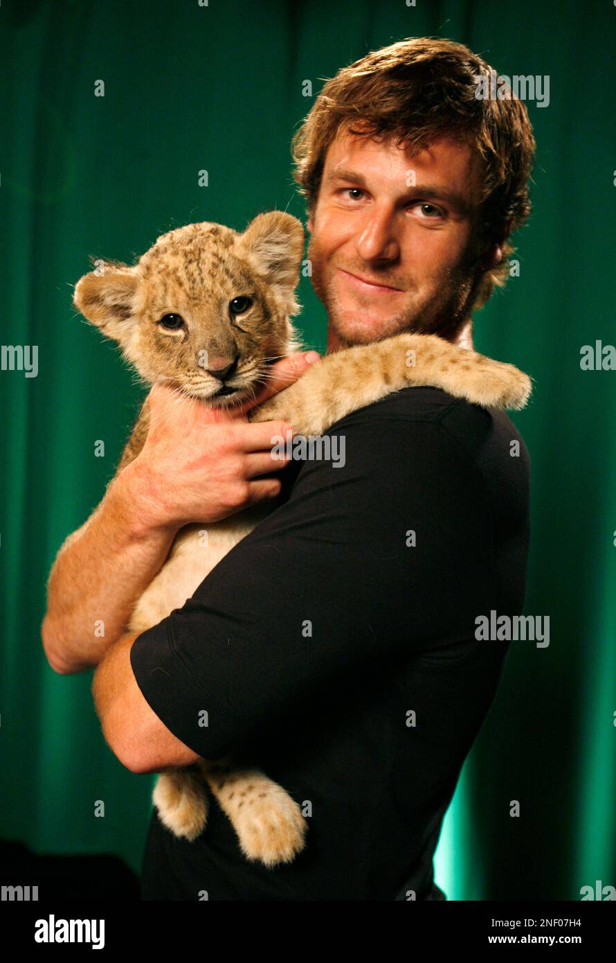 Dave Salmoni who is Animal Planet's large predator expert, poses with a ...