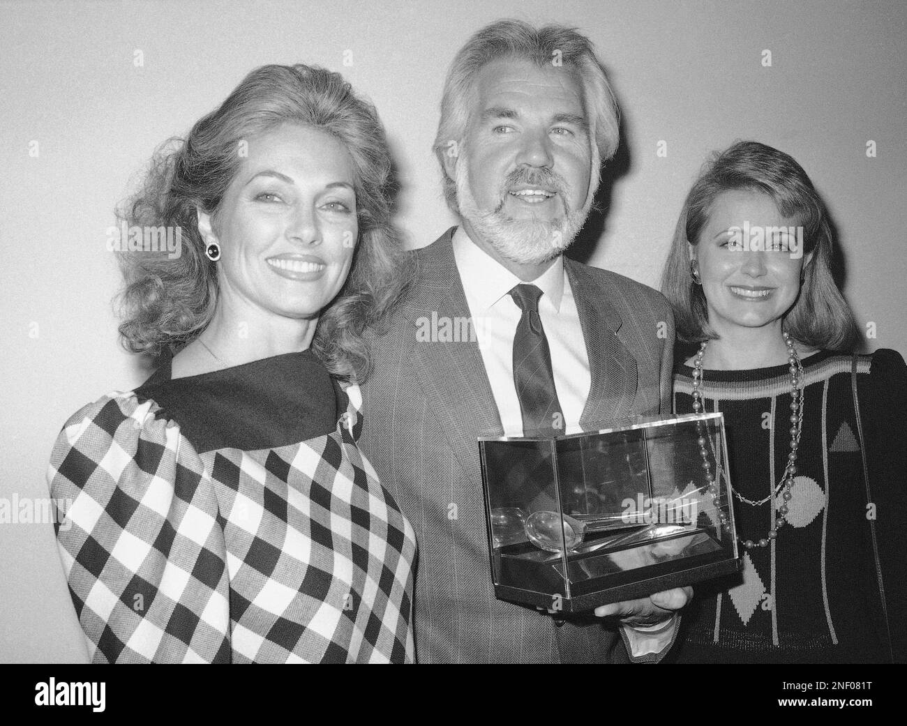 Kenny Rogers, center, stands with his wife Marianne, left, and Jane ...