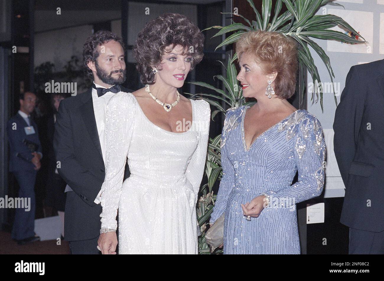 Actresses Joan Collins, left, and Elizabeth Taylor appear together ...