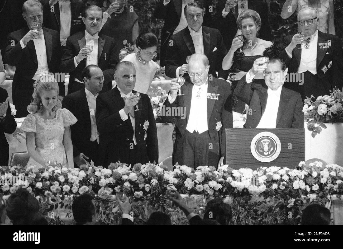 President Richard Nixon, far right, offers a personal toast to French ...